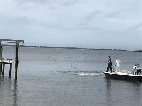Picture Of Me Throwing A 12 Ft Cast Net On A School Of Mullet Caught Almost 400 Lbs On This