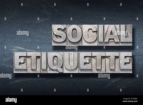 Social Etiquette Phrase Made From Metallic Letterpress On Dark Jeans