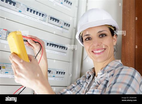 A Woman Measuring Electrical Current Stock Photo Alamy