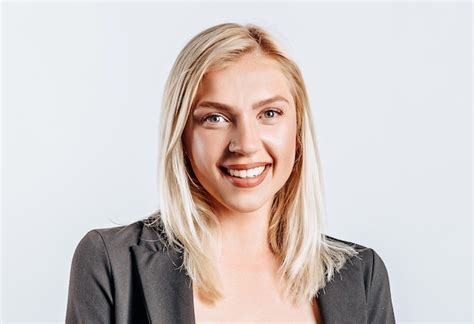 Premium Photo Positive Blonde Girl Smiling Isolated On Gray