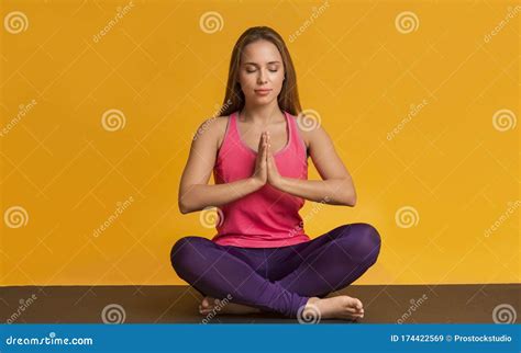 Namaste Portrait Of Relaxed Woman Practicing Yoga Meditating In Lotus