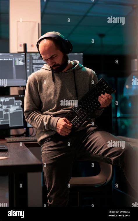 Young Coder Fooling Around With Keyboard Playing Guitar Working On