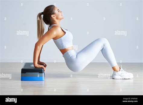 Adult Beautiful Woman Working Using Stepper Out Over Light Background Stock Photo Alamy