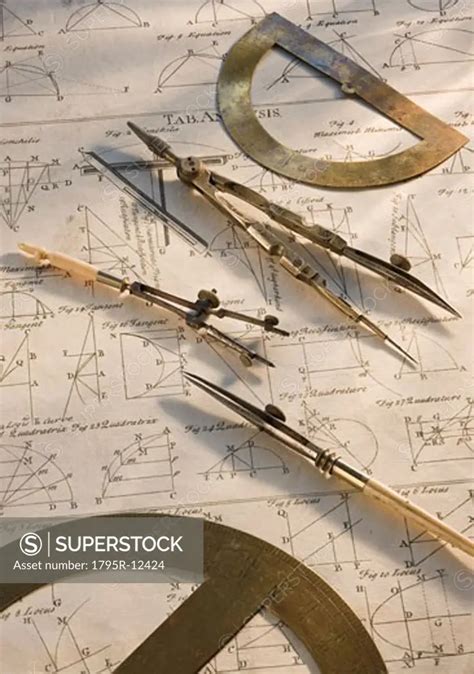 Protractors And Drafting Compasses On Antique Map Superstock