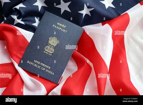 Blue Indian Passport On United States National Flag Background Close Up