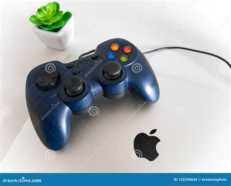USB Gamepad Controller Attached To Apple Macbook Pro Laptop Concept Editorial Stock Image