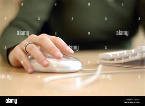 Woman S Hand Using Computer Mouse Stock Photo Alamy