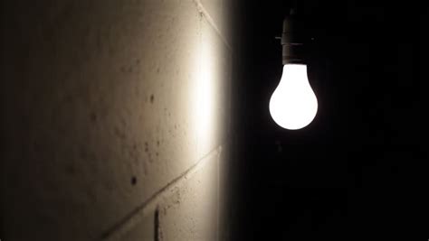 Light Bulb Swaying Against Wall In Dark Room Stock Footage Video 3853673 Shutterstock