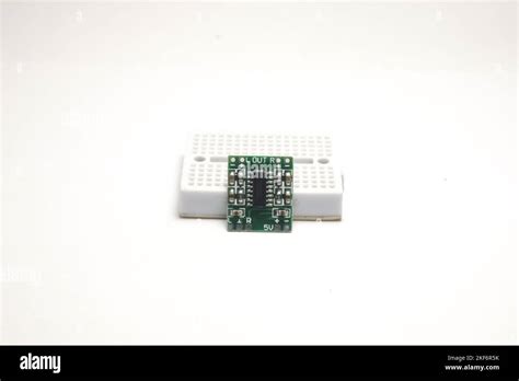 A Small Audio Amplifier Module Rests On A Project Board Used As Diy Material For The Electronics