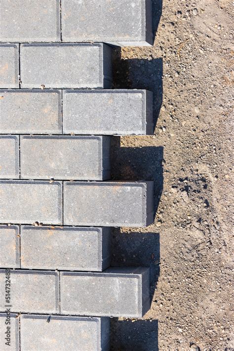 Pavement Repairs And Paving Slabs Laying On The Prepared Surface With Tile Cubes In The