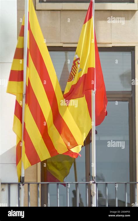 Vibrant Spanish And Catalan Flags Flutter Together Their Colors A