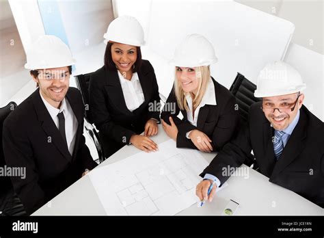 Group Of Architects At The Meeting Discussing The Project Stock Photo Alamy