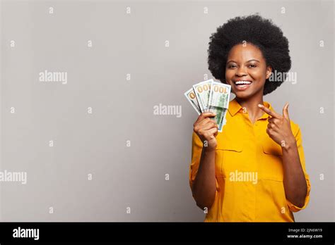 Woman Winning Money Happy Woman With Surprised Expression Holding Bunch Of Hundred Dollar Bill