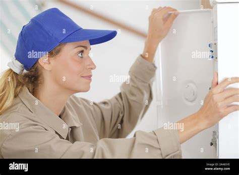 Woman Measuring Electrical Current Stock Photo Alamy