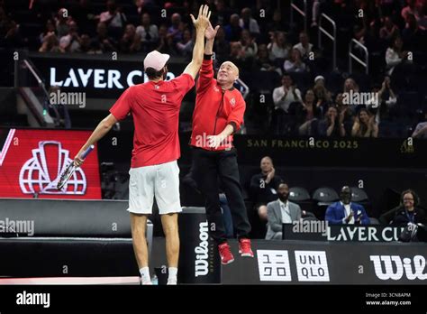 Team World Captain Andre Agassi Right Jumps To Congratulate Reilly