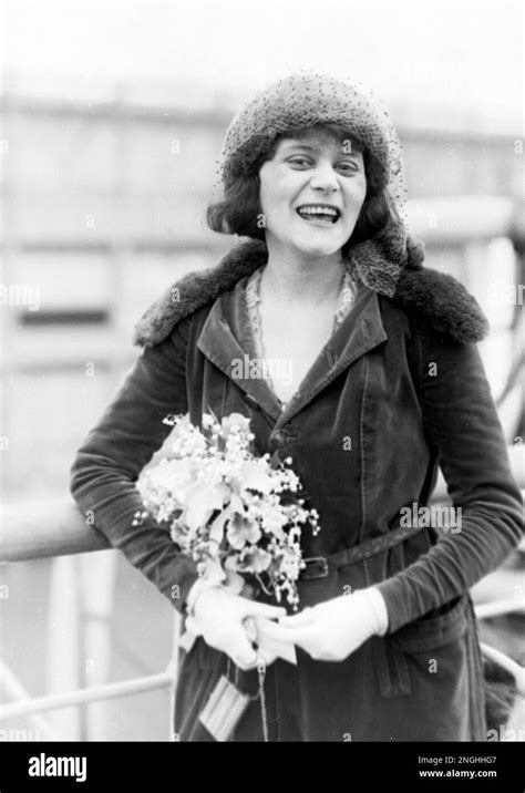 Stage And Film Actress Theda Bara Poses With A Flower Corsage On April