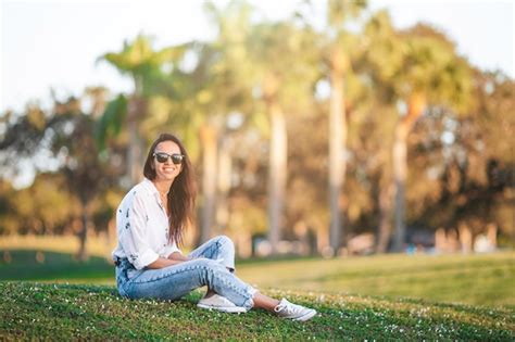 Premium Photo Portrait Of Happy Young Woman Outdoor In The Park At Sunset