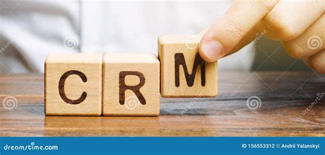 Wooden Blocks With The Word Crm Customer Relationship Management And