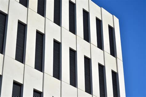 Premium Photo Modern Office Building Detail Perspective View Of Geometric Angular Concrete Windows