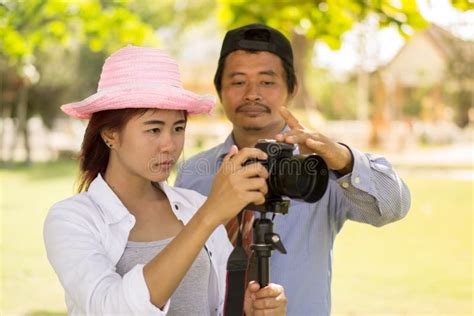 Asian Teen Is An Amateur Photographer Practicing Photography Stock