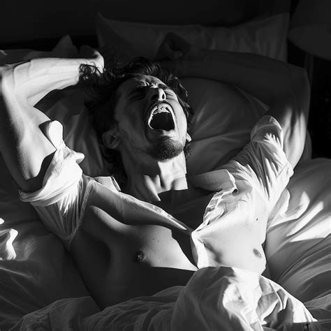 A Man With His Mouth Open And His Mouth Open In A Bed Premium Ai