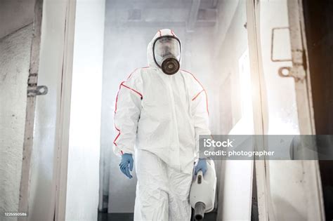 Male In Protective Hazmat Suit And Gasmask Pathogen Respiratory