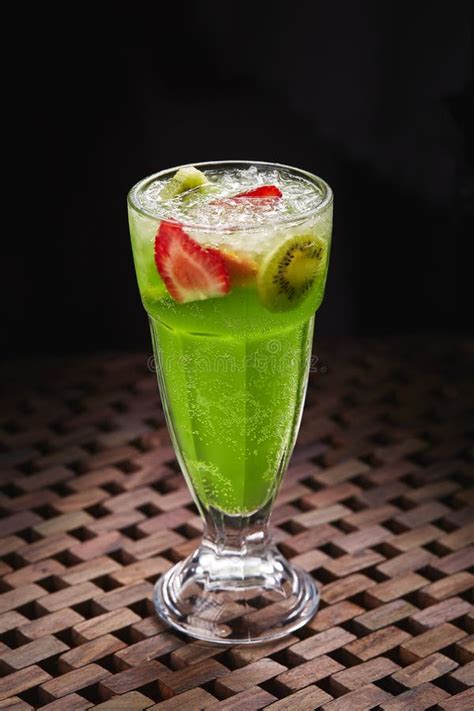 Attica Cocktail Soda Drink With Strawberry Slice Served In Glass
