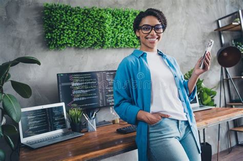Photo Of Lovely Young Lady Hold Device Coding Monitors Dressed Blue