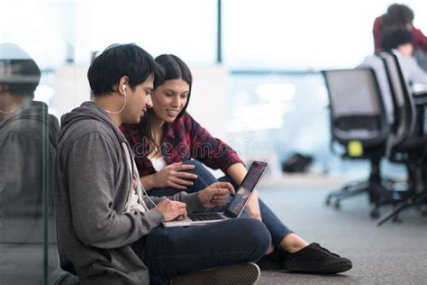 Software Developers Couple Working On The Floor Stock Image Image Of