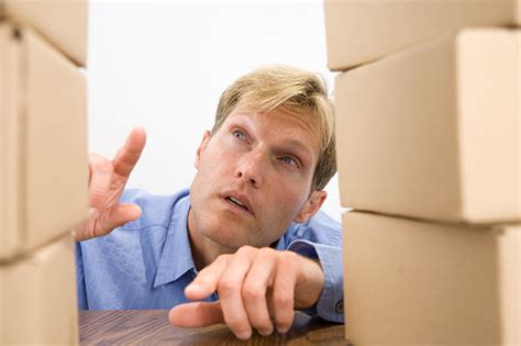 Man Counting Boxes On Table Free Photo Download Freeimages
