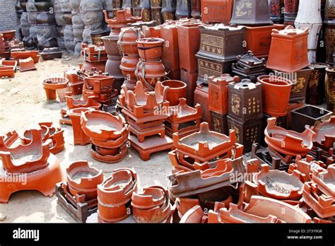 Flowerpot And Flower Gardening Tools Stacked Together In A Shop Stock