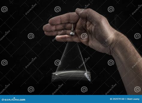 Hand Swinging Pendulum Royalty Free Stock Image