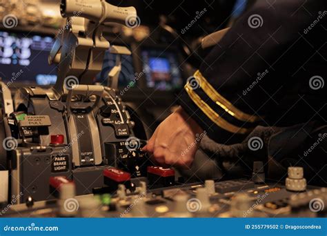 Female Copilot Pushing Buttons And Switch On Dashboard Panel Royalty Free Stock Photography