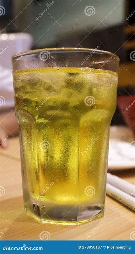Japanese Green Tea Or Ocha Tea Or Yellow Drink Tea Served In A Tall