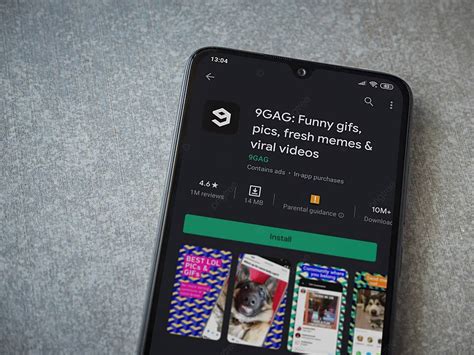 a black smartphone display showing the play store page for the 9gag app