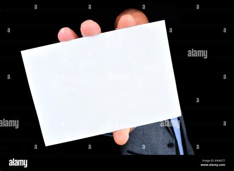 A Young Caucasian Man Wearing A Gray Suit Holds A Blank Signboard In