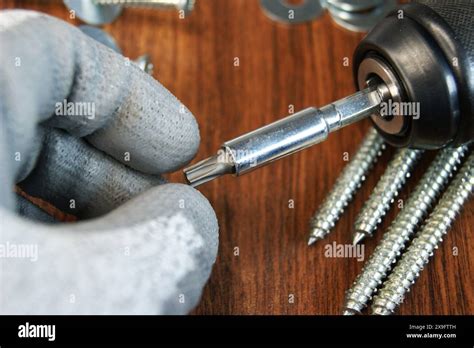 Removing The Torx Bit From The Adapter Work Process Of The Builder