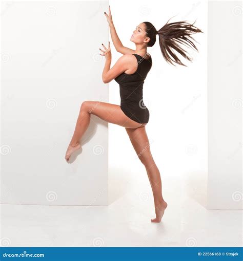 Barefoot Ballerina Dressed In A Business Suit Poses For A Laptop And