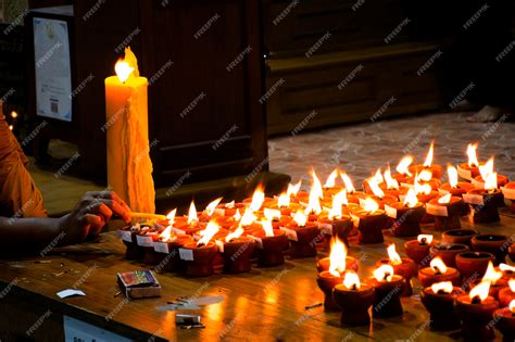 Premium Photo Thai Young Monk Light A Fire Candle For Respect Praying Buddha God Deity Angel
