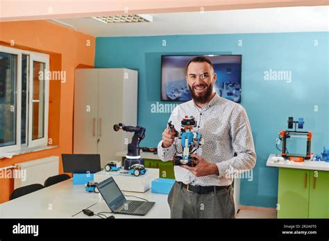 A Man Working In A Robotics Laboratory Focusing On The Intricate Fields Of Robotics And 3d