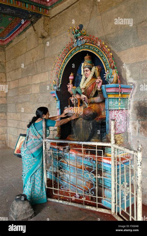 Woman Worshiping Goddess Parvati In Sri Meenakshi Amman Temple