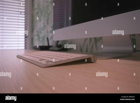 Low Angle View Of Keyboard And Computer On A Desk In A Modern Home Office Stock Photo Alamy