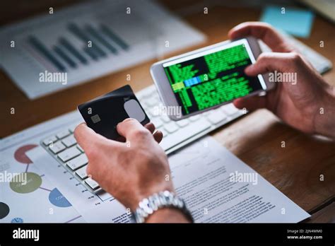 Cybersecurity Issues Or Credit Card Theft By A Hacker Using His Phone
