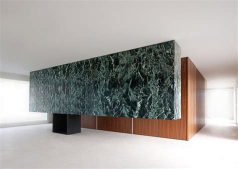 Monolithic Marble Partition Divides Antwerp Penthouse