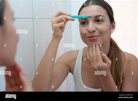 Close Up Of Beautiful Young Woman Shaving Her Face By Razor At Home Pretty Woman Using Razor On