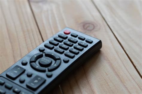 Premium Photo Close Up Of Remote Control On Table