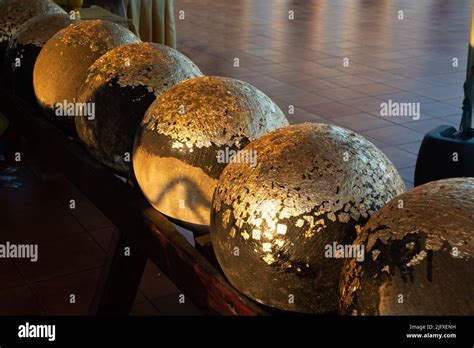 Gold Foils Pasted On The Surface Of Luuk Nimit Round Stones For Buried