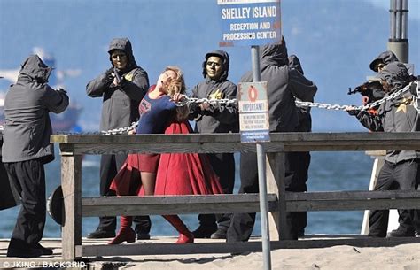Melissa Benoist As Supergirl Struggles In Chains Surrounded By Armed