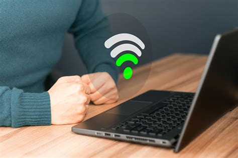 Man Using A Computer Laptop To Connect To Wifi But Wifi Signal Is Very Weak And Waiting To