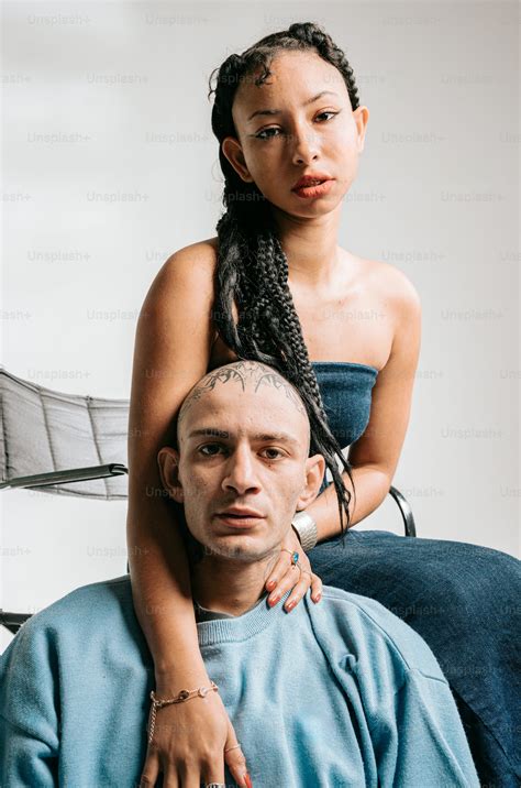 A Woman Sitting On Top Of A Mans Shoulder Photo Fashion Image On